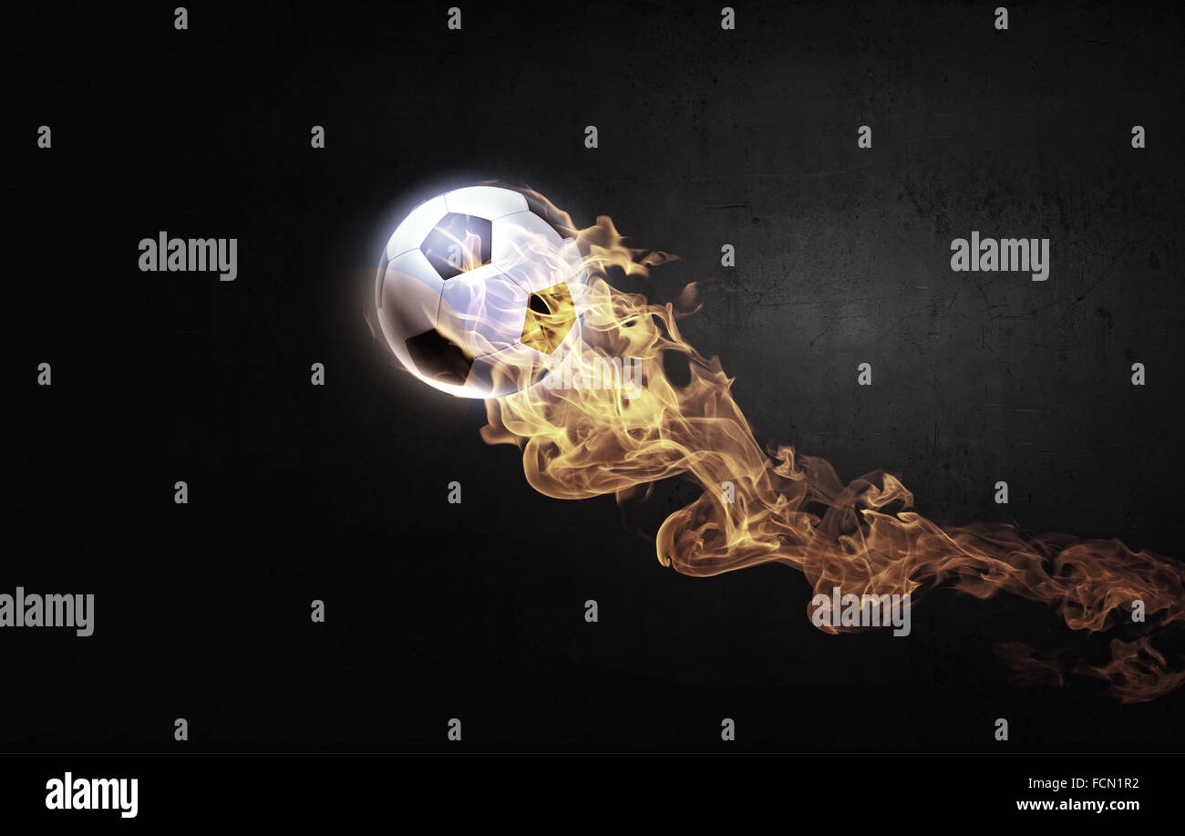Conceptual image of football ball in fire flames Stock Photo - Alamy