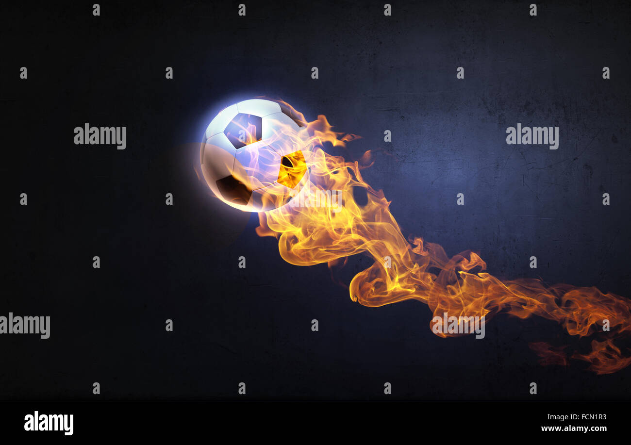 Conceptual image of football ball in fire flames Stock Photo - Alamy