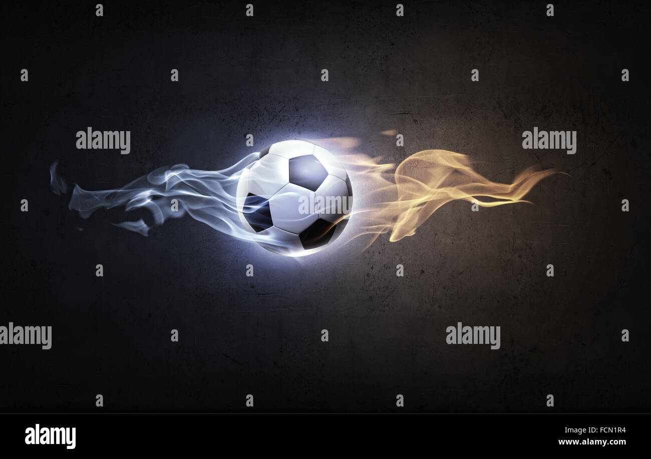 Conceptual image of football ball in fire flames Stock Photo - Alamy