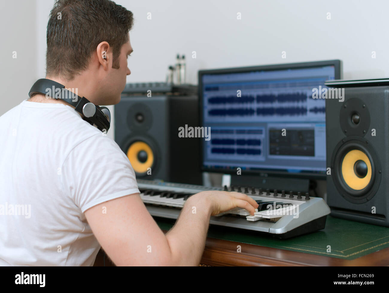 Male sound producer working in recording studio Stock Photo - Alamy