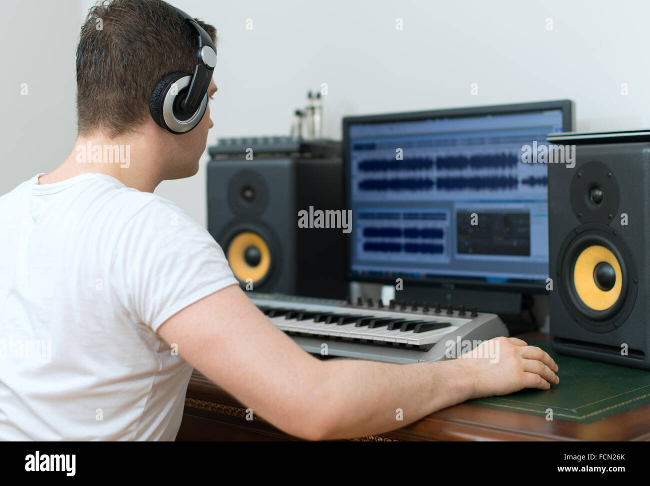 Male sound producer working in recording studio Stock Photo - Alamy
