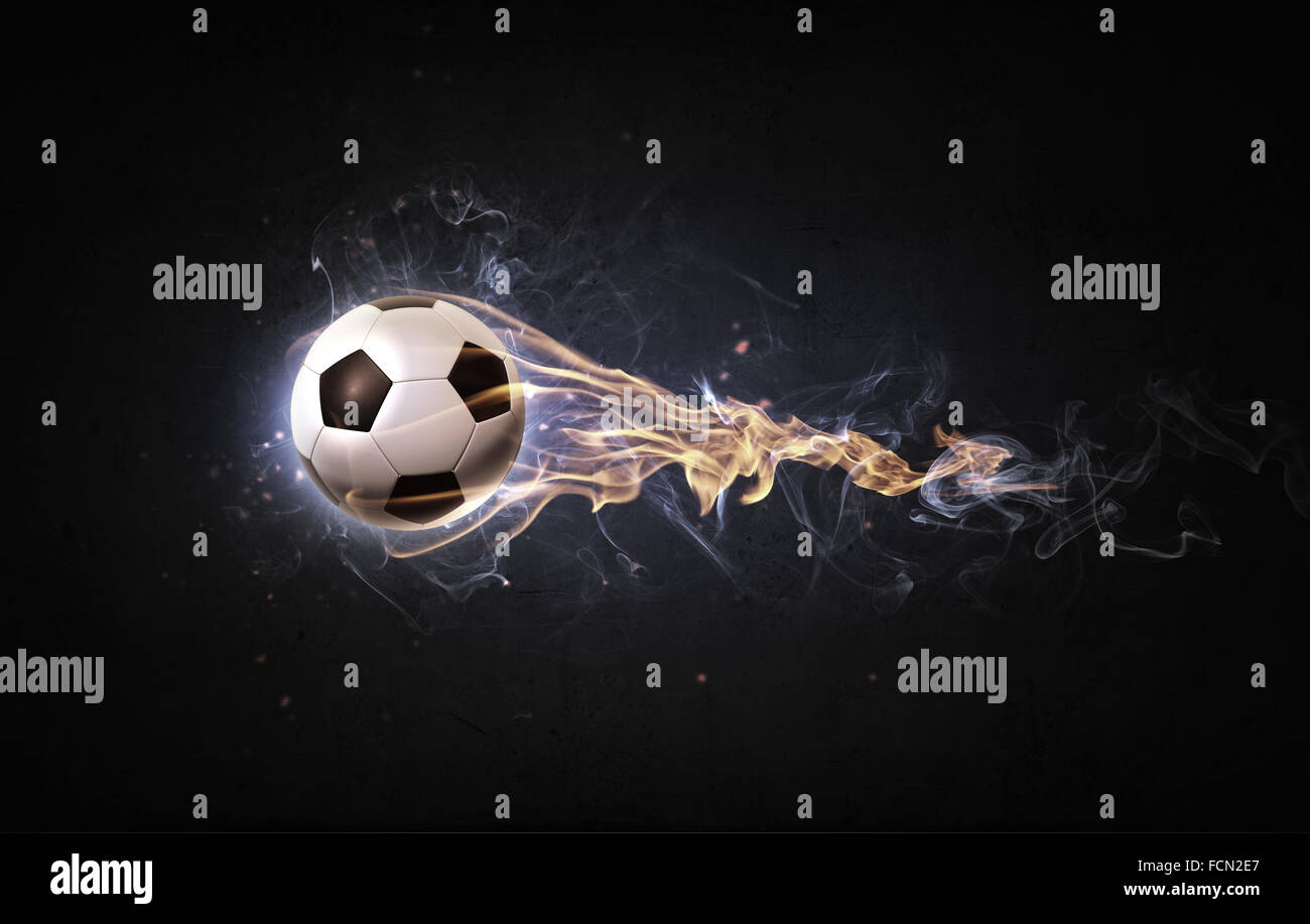 Conceptual image of football ball in fire flames Stock Photo - Alamy