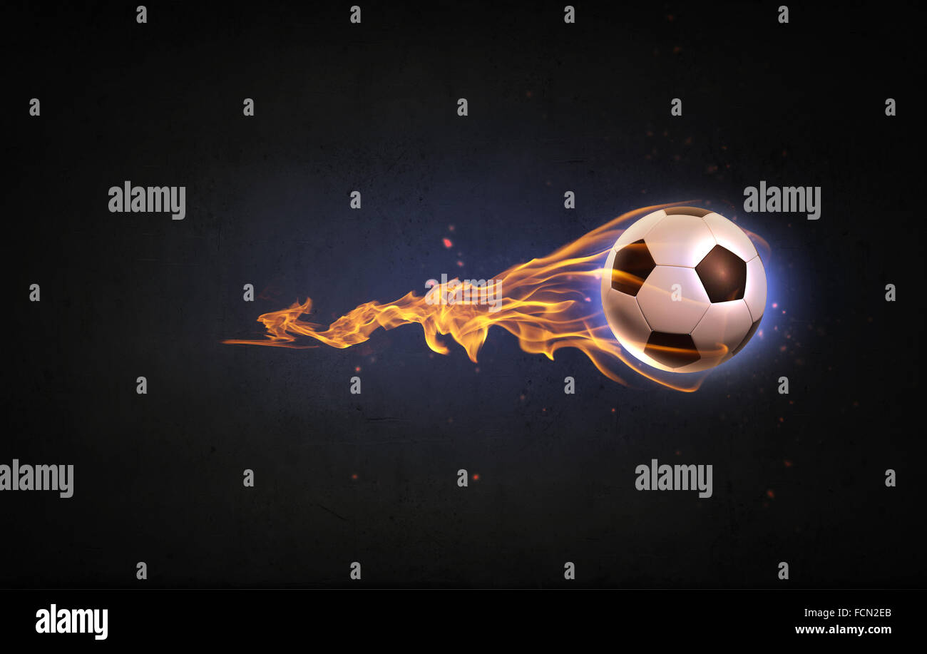 Conceptual image of football ball in fire flames Stock Photo - Alamy