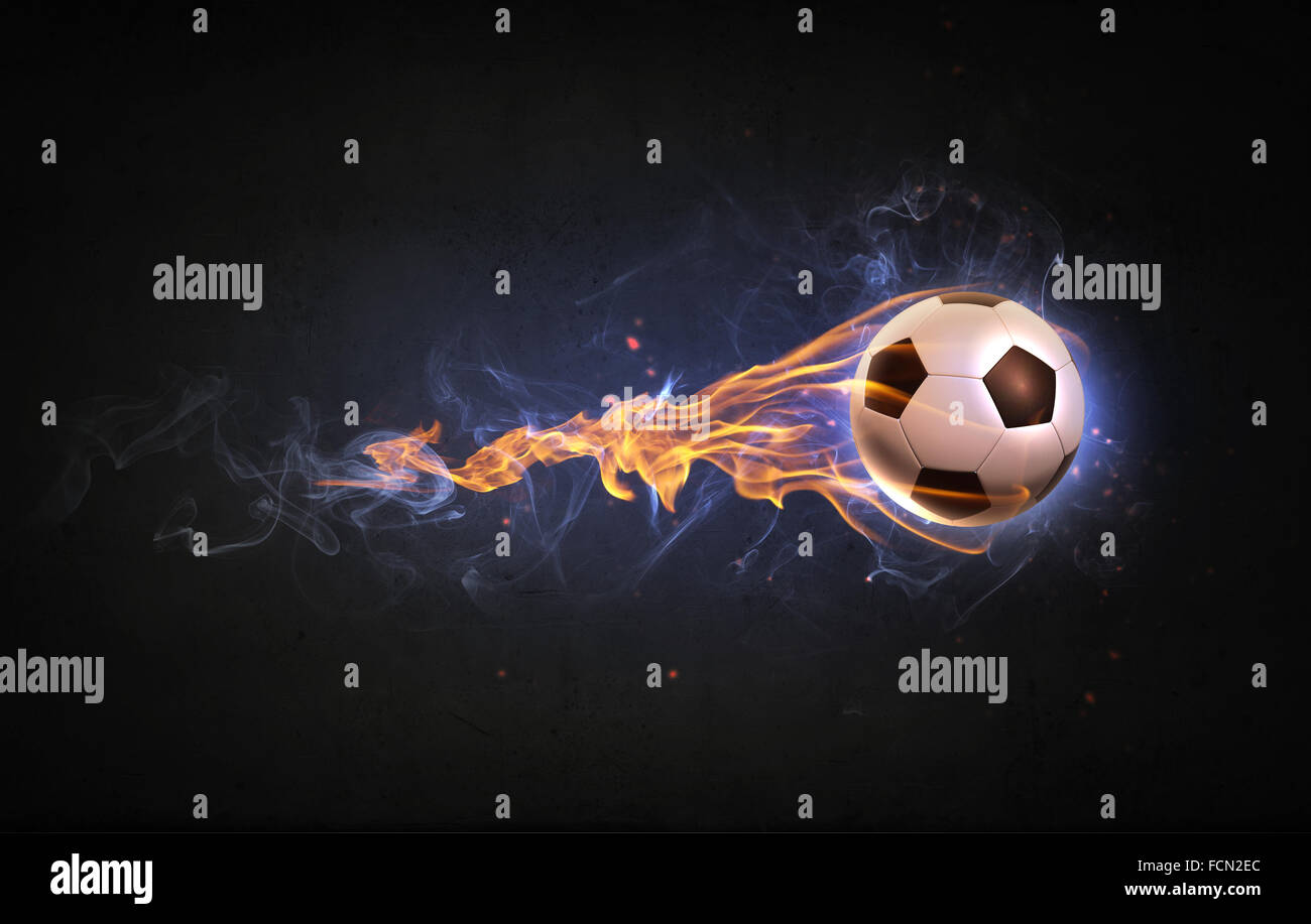 Conceptual image of football ball in fire flames Stock Photo - Alamy