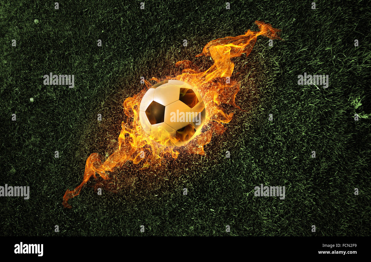 Conceptual image of football ball in fire flames Stock Photo - Alamy