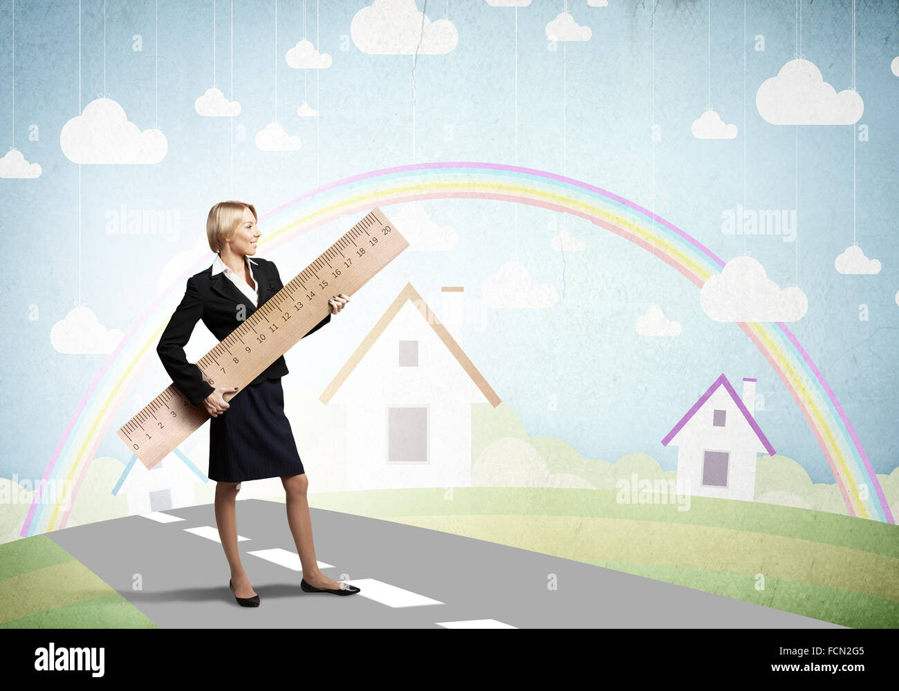 Young businesswoman measuring something with big ruler Stock Photo - Alamy