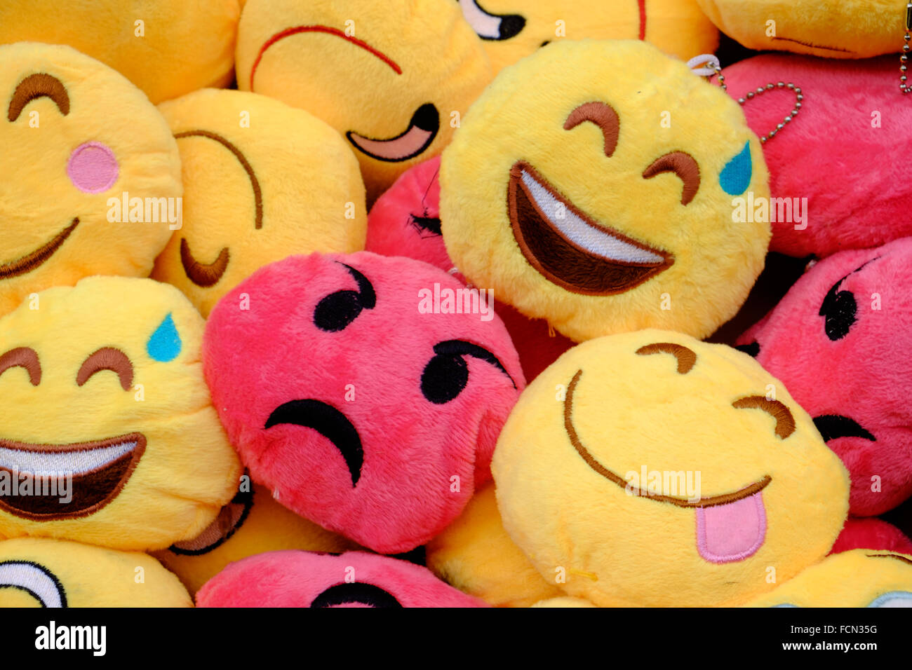 Angry face in a crowd of happy faces Stock Photo - Alamy