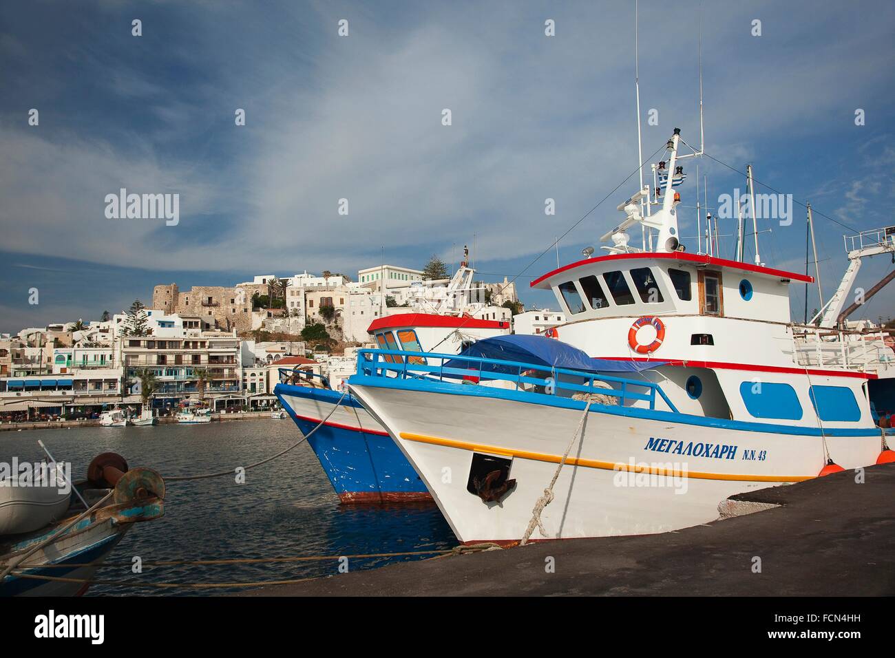 Fishing boats at the port in town center, Naxos, Cyclades Islands ...