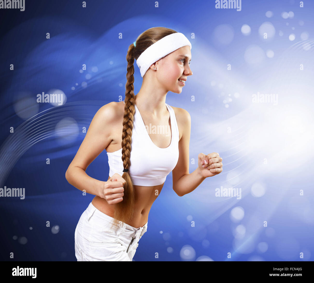 Young pretty woman in sport wear running Stock Photo - Alamy