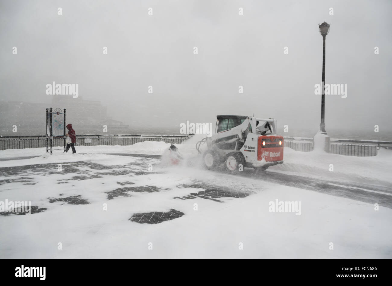 Jersey City, USA. 23rd Jan, 2016. A snow sweeper clears the ...