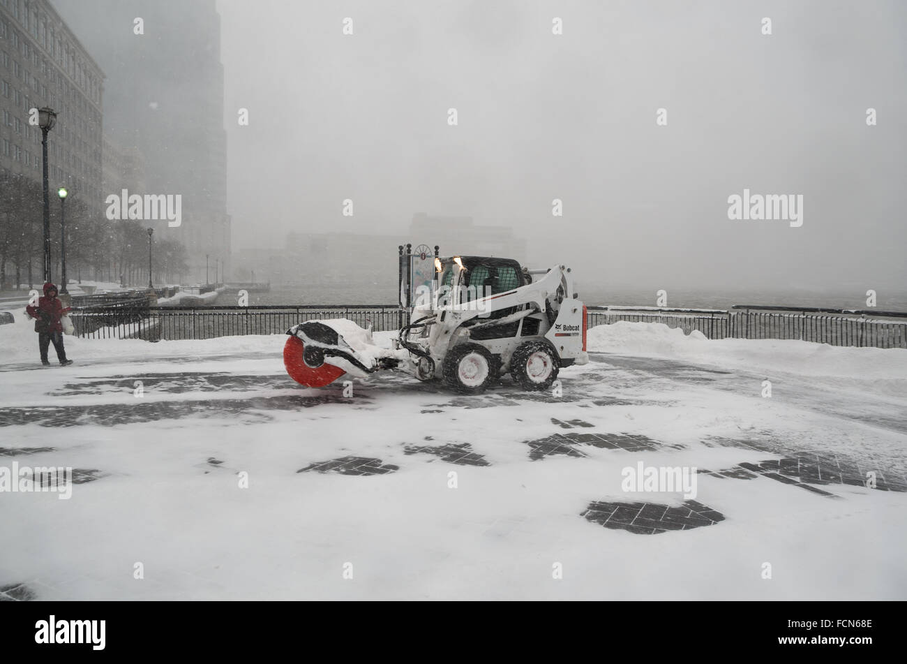 Jersey City, USA. 23rd Jan, 2016. A snow sweeper clears the ...