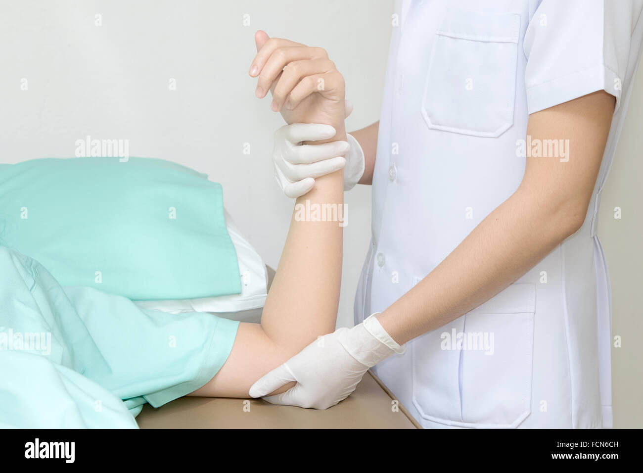 Physical therapist doing hand exercise after injury hand Stock Photo ...