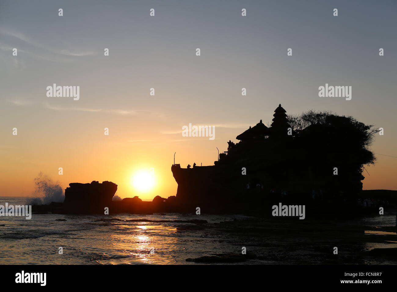 Tanah Lot Temple in Bali during sunset Stock Photo - Alamy