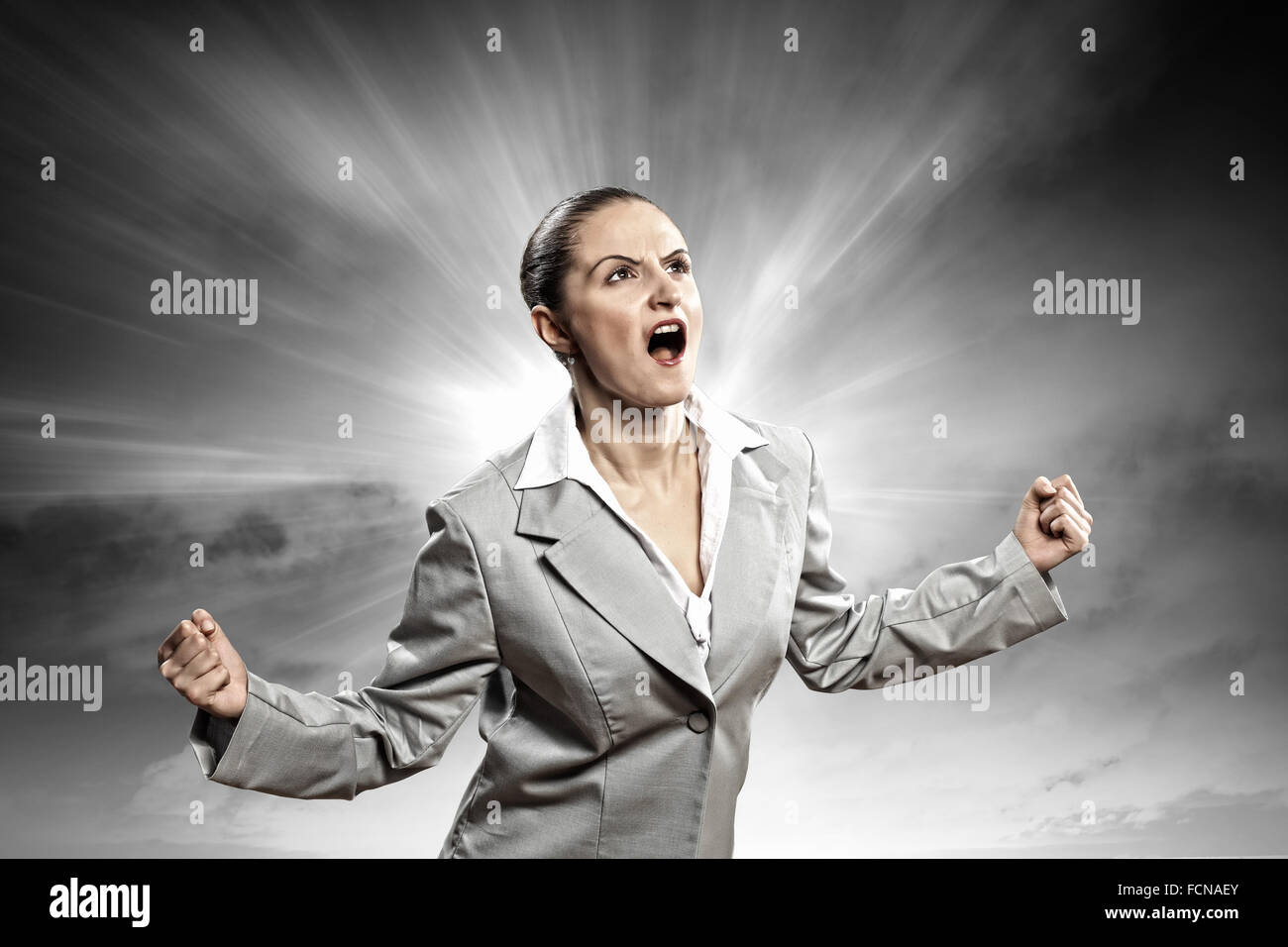 businesswoman in anger screaming standing in flash of light Stock Photo ...