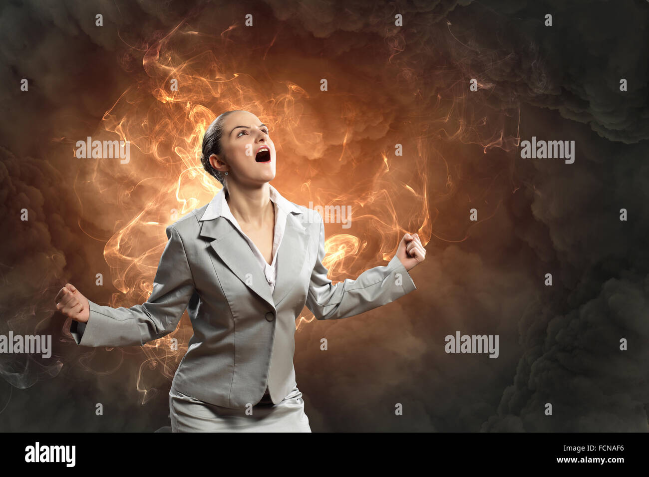 businesswoman in anger screaming against smoky background Stock Photo ...
