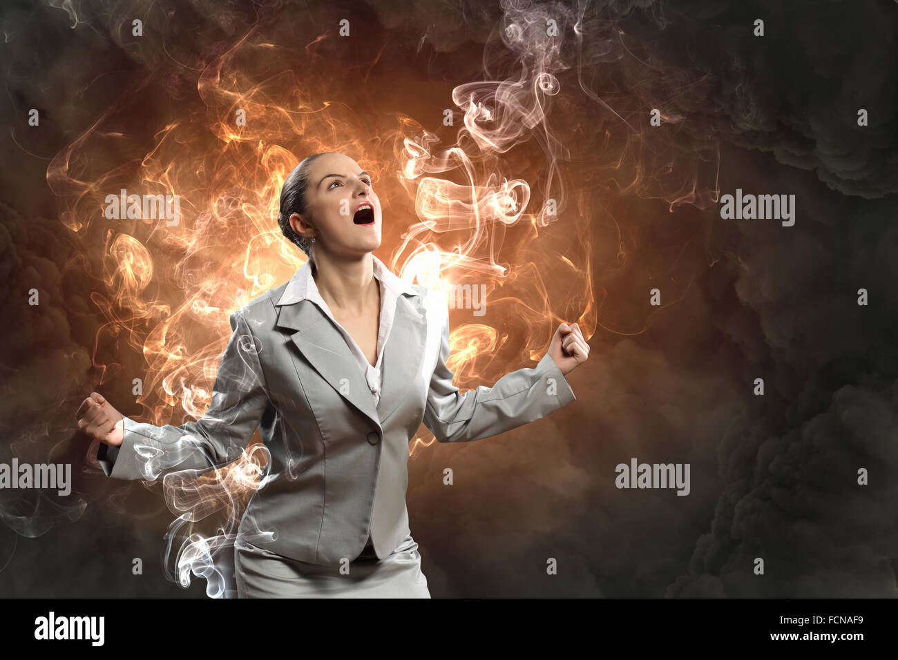 businesswoman in anger screaming against smoky background Stock Photo ...