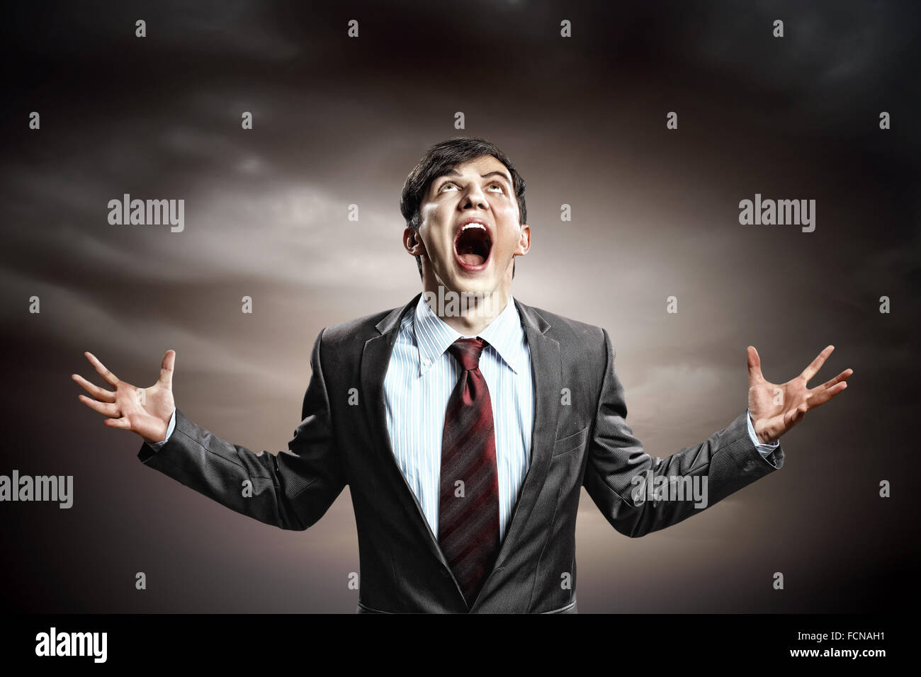 businessman in anger with fists clenched screaming Stock Photo - Alamy