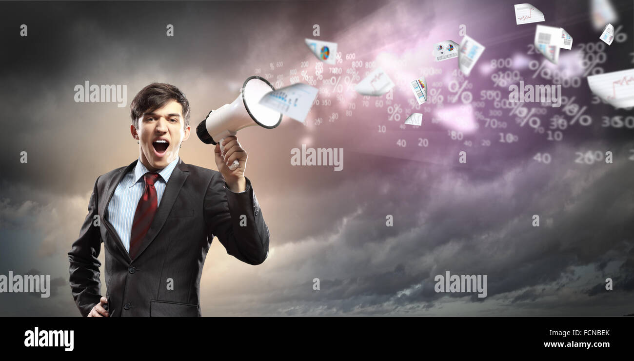young businessman in black suit screaming into megaphone Stock Photo ...