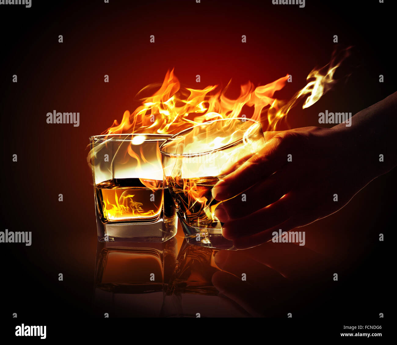 Image of two glasses of burning yellow absinthe Stock Photo - Alamy