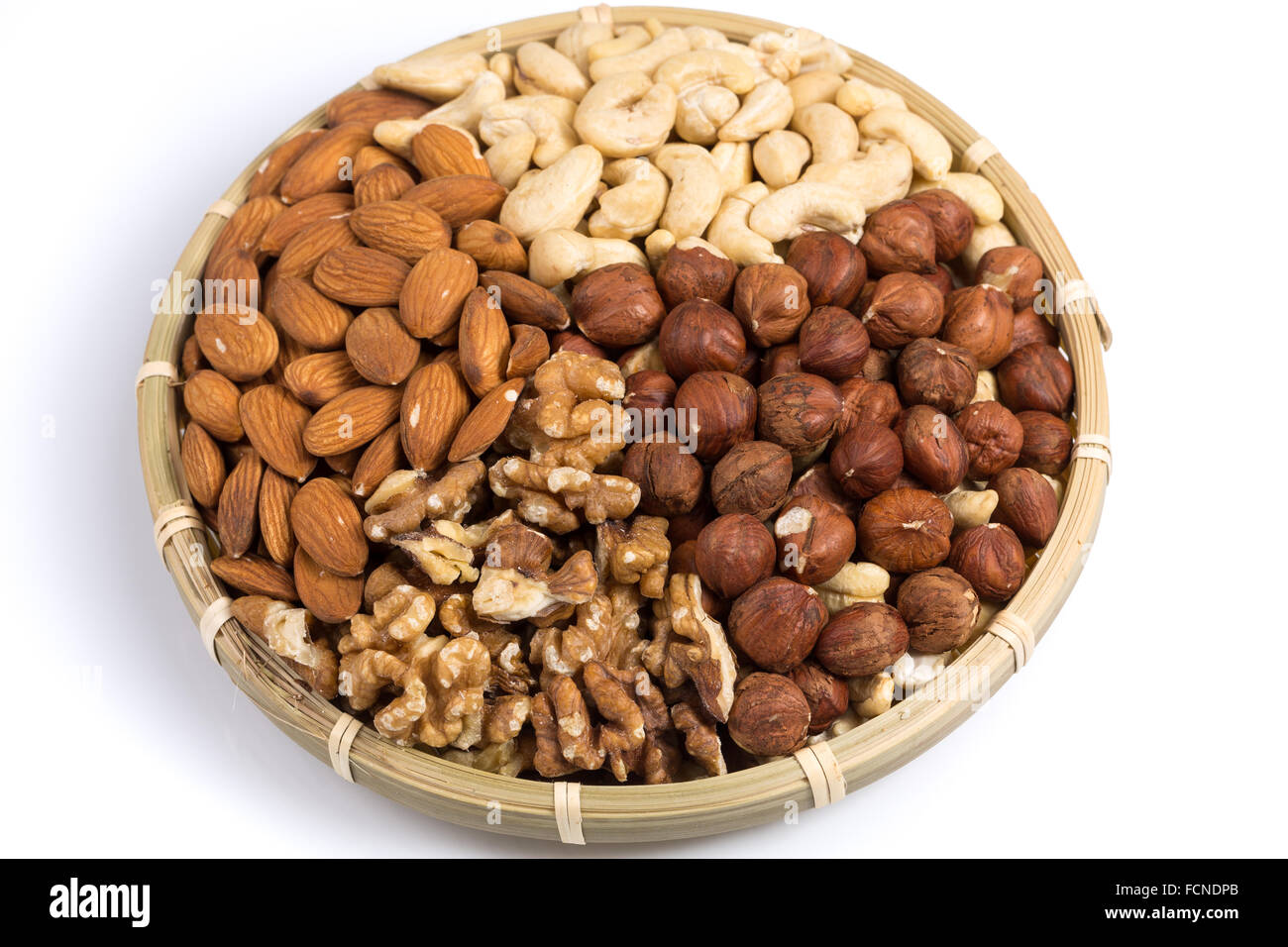 Set of nuts in bowl isolated on white background Stock Photo - Alamy