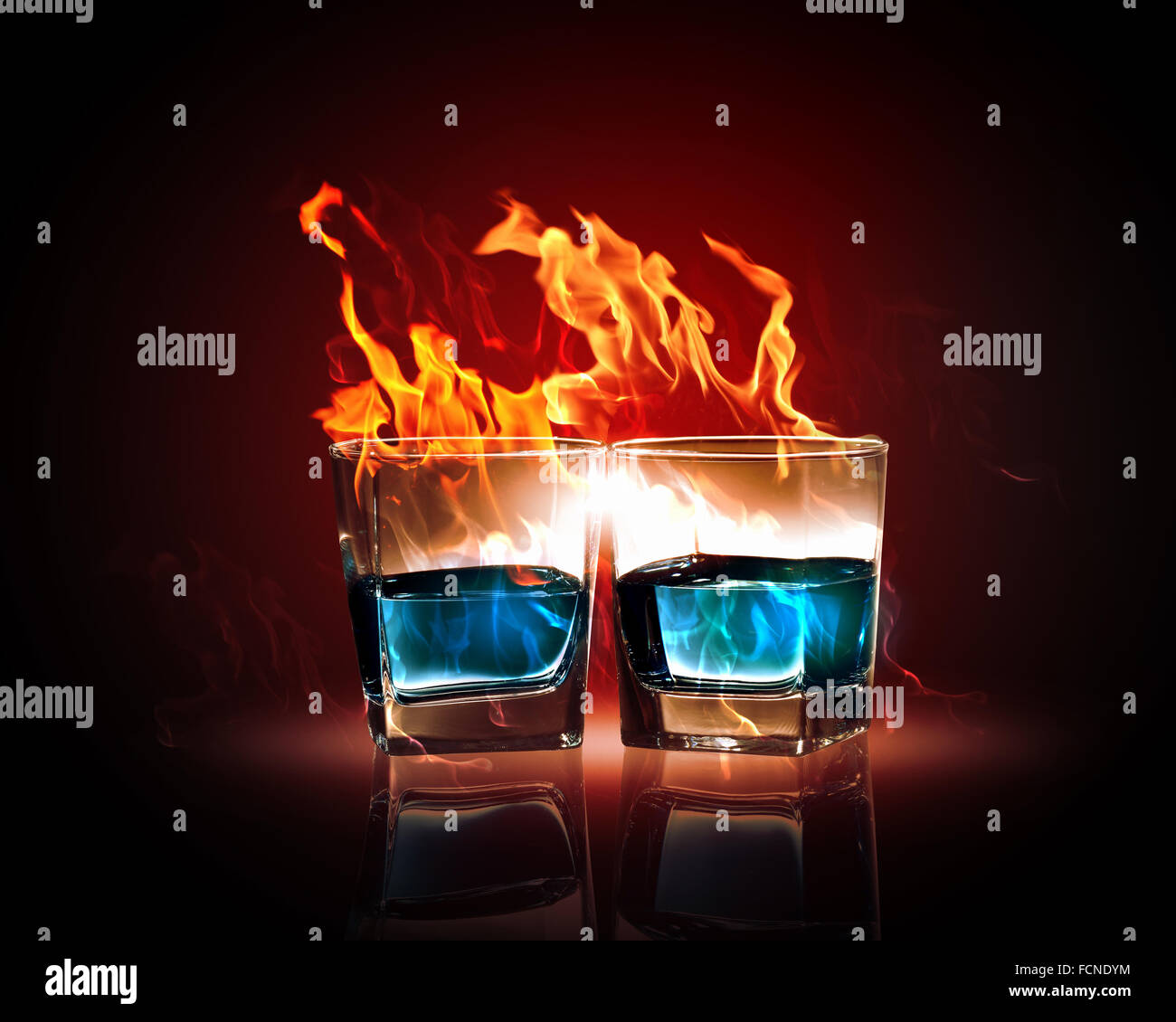 Image of two glasses of burning emerald absinthe Stock Photo - Alamy
