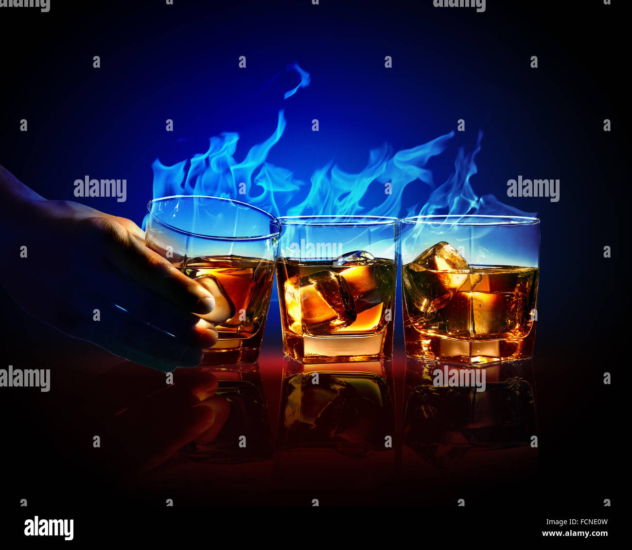 Image of three glasses of burning yellow absinthe Stock Photo - Alamy
