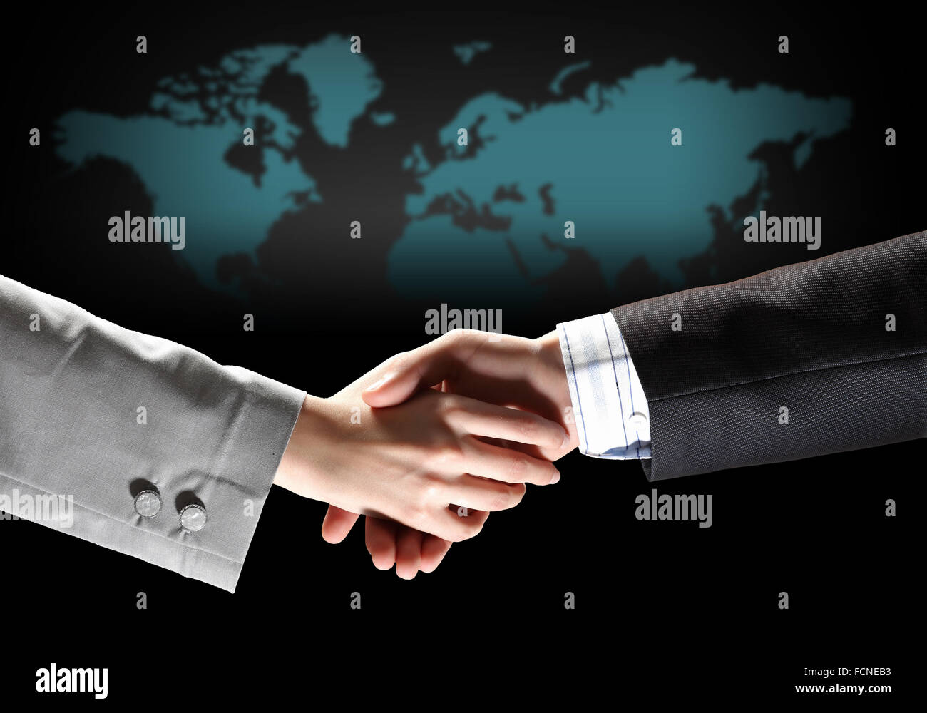 business handshake against black background with map image Stock Photo ...