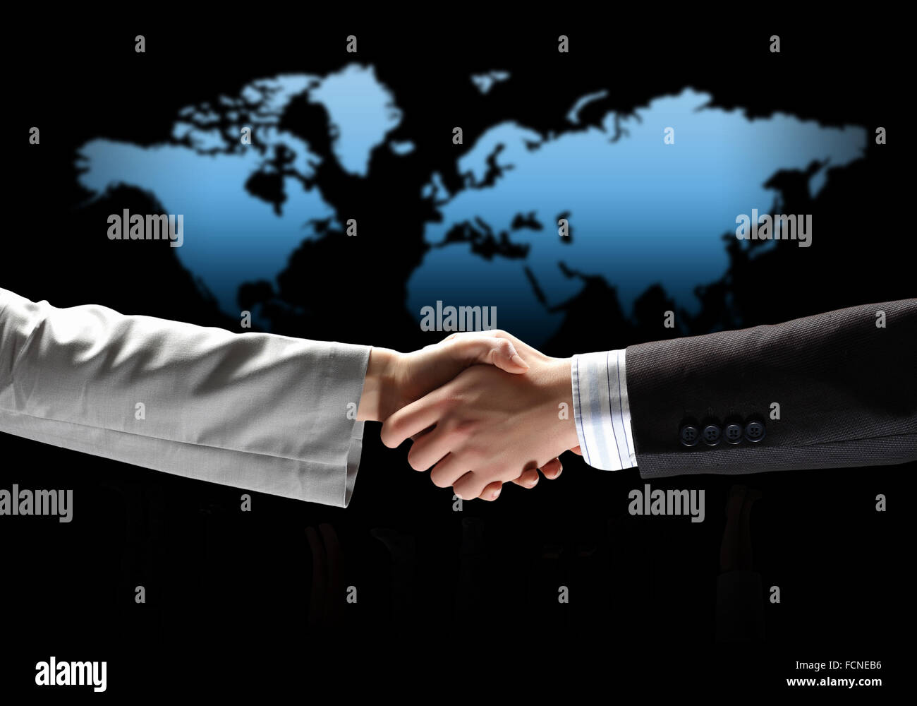 business handshake against black background with map image Stock Photo ...