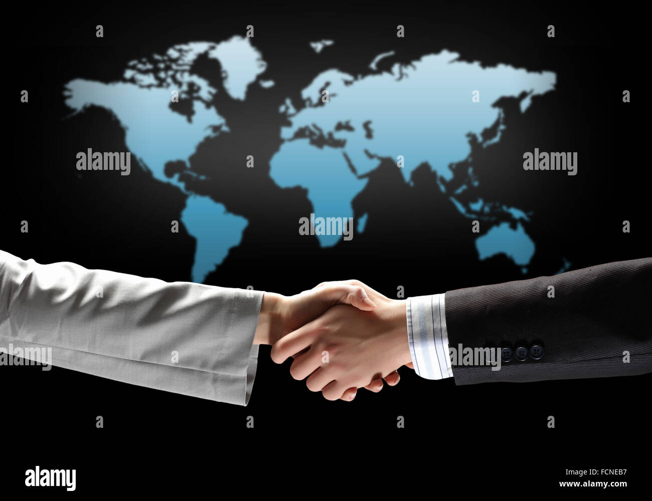 business handshake against black background with map image Stock Photo ...