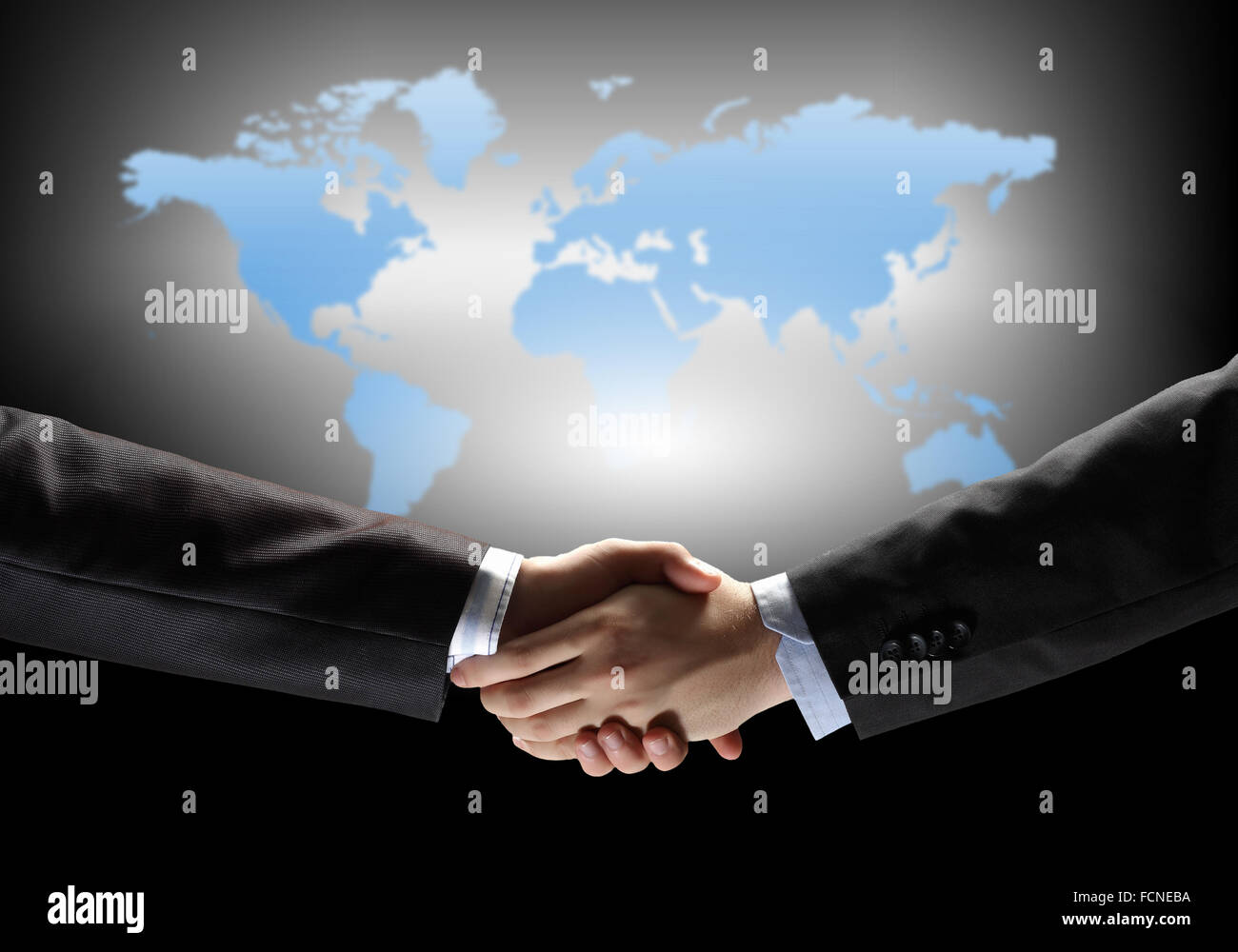 business handshake against black background with map image Stock Photo ...
