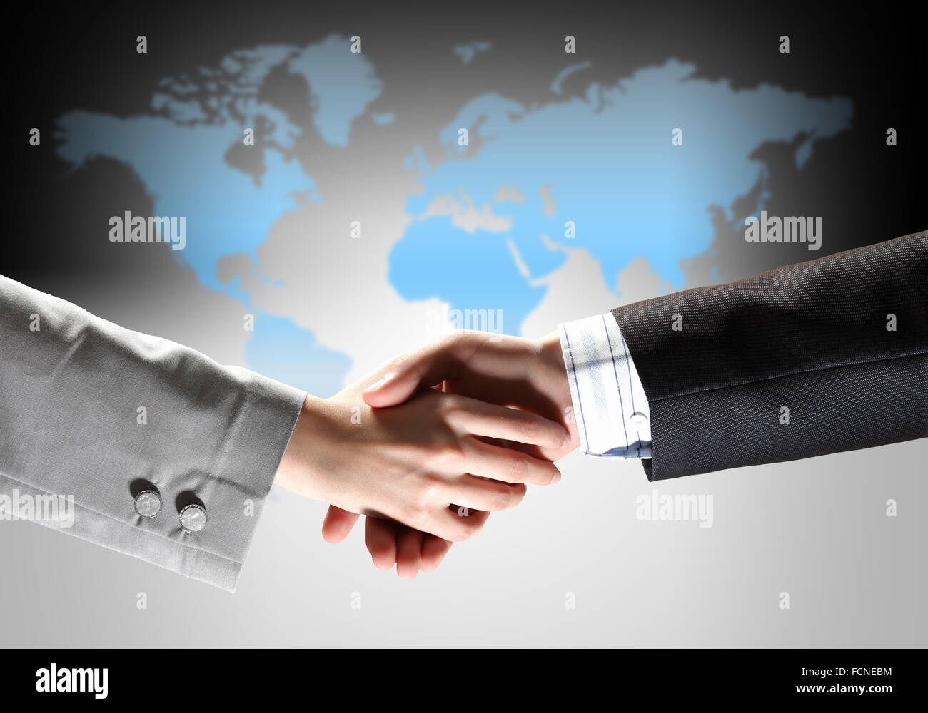business handshake against black background with map image Stock Photo ...