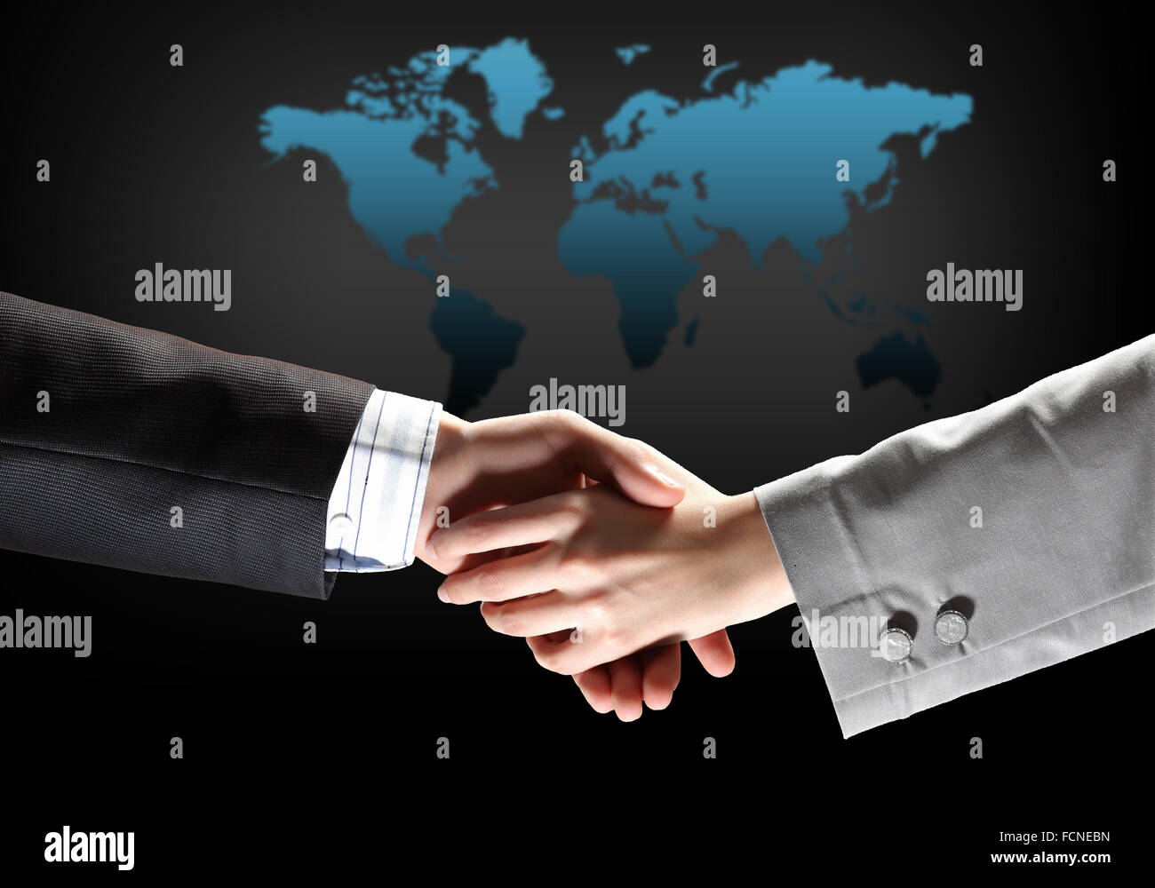 business handshake against black background with map image Stock Photo ...