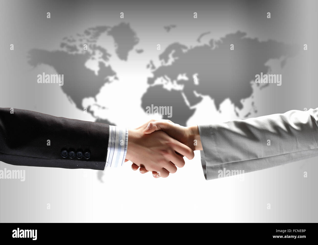 business handshake against black background with map image Stock Photo ...