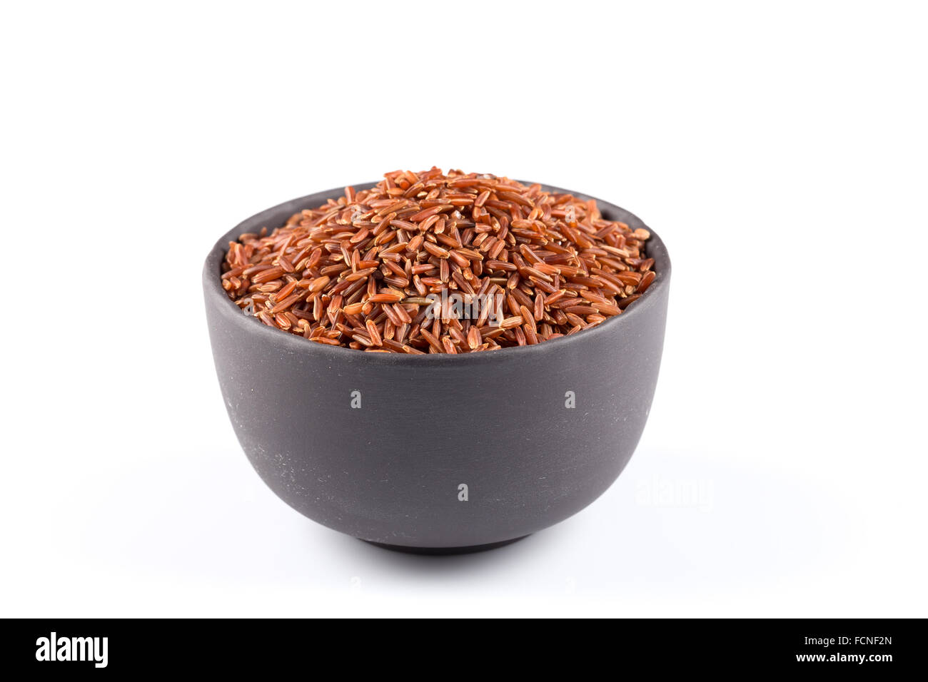 Bowl of Red Cargo Rice. Shot on white background Stock Photo - Alamy