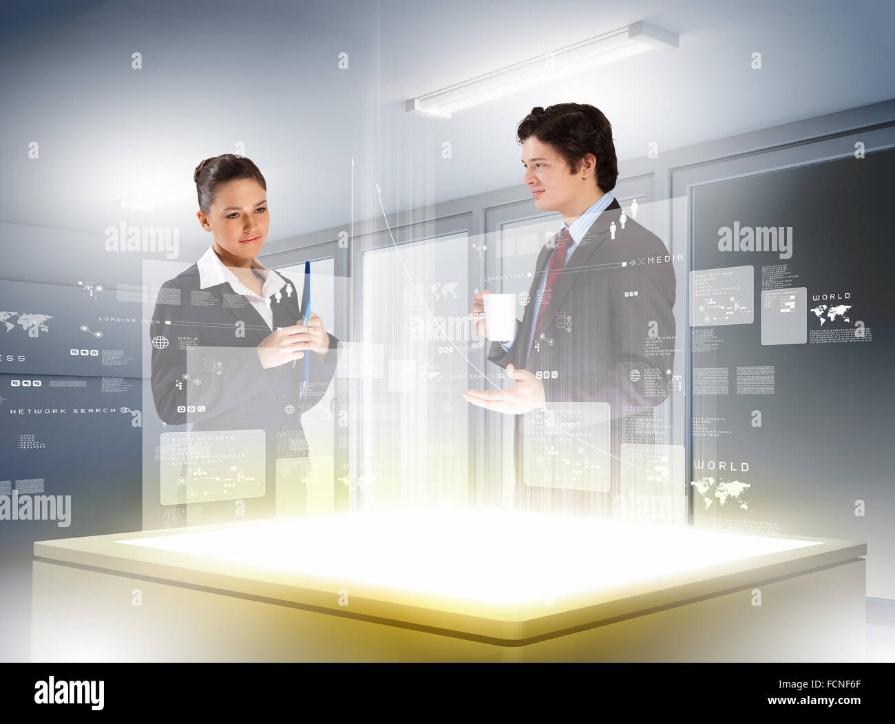 young businesspeople looking at graph of high-tech image Stock Photo ...