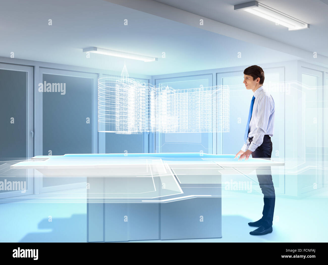 young businessman looking at high-tech image of building model Stock ...