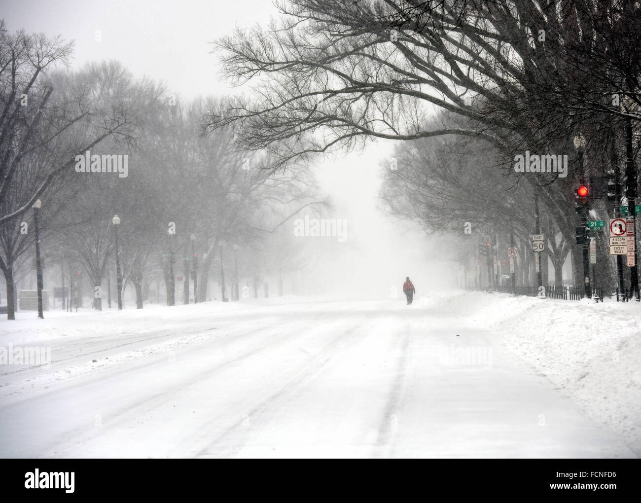 Washington, DC, USA. 23rd Jan, 2016. A man walks on Constitution Avenue ...