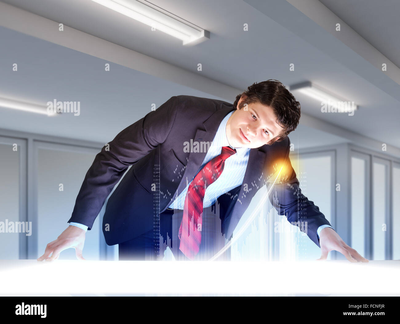 Image of young businessman looking at high-tech picture Stock Photo - Alamy