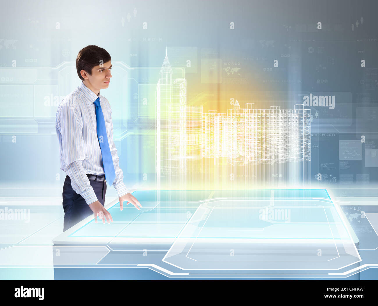 young businessman looking at high-tech image of building model Stock ...