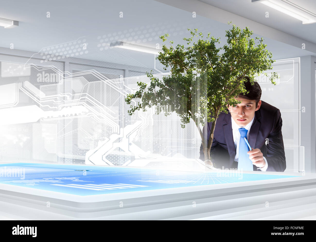 Image of young businessman touching icon of high-tech picture of ...