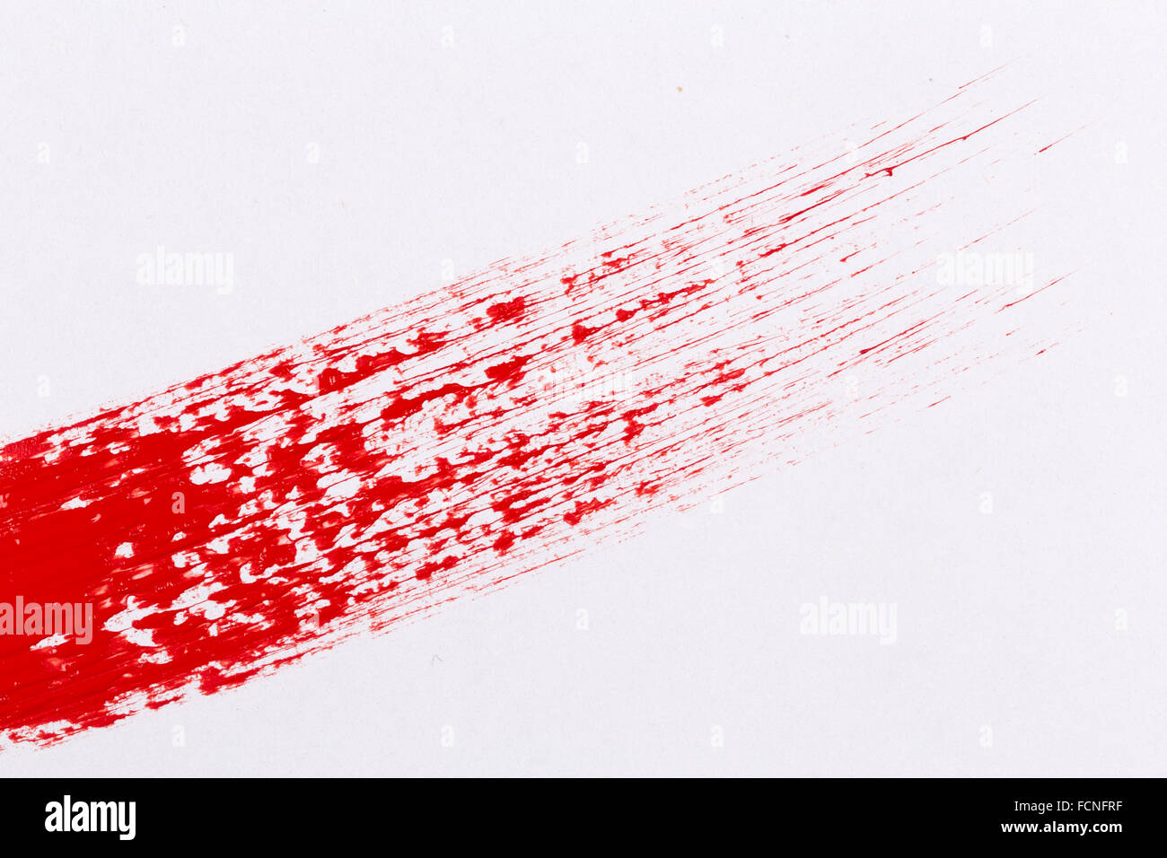 Red paint splash on a white paper Stock Photo - Alamy