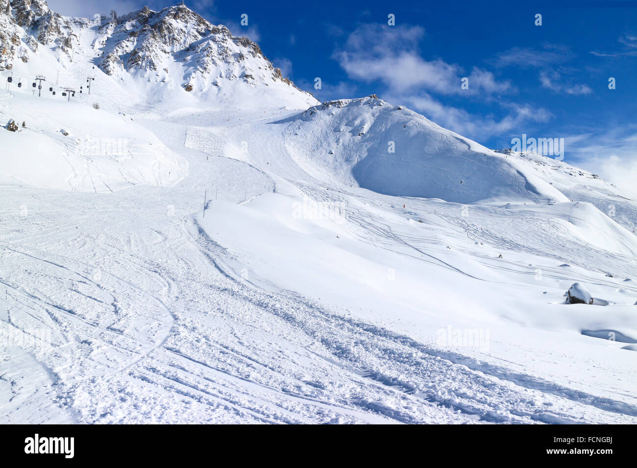Ski snowboard pistes, snowy mountain peaks in high Alps resort of Three ...
