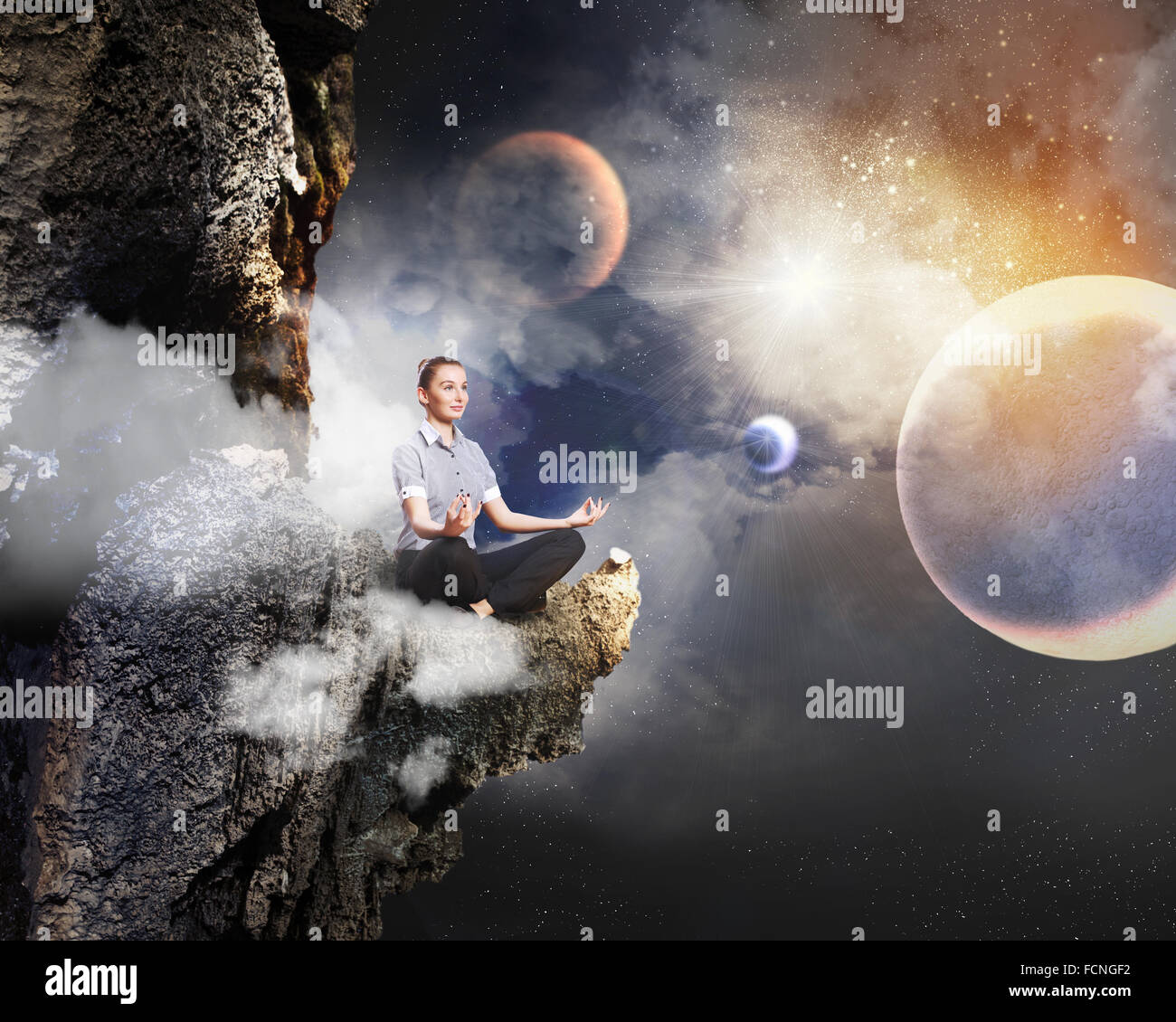 Businesswoman sitting in lotus flower position against space background ...