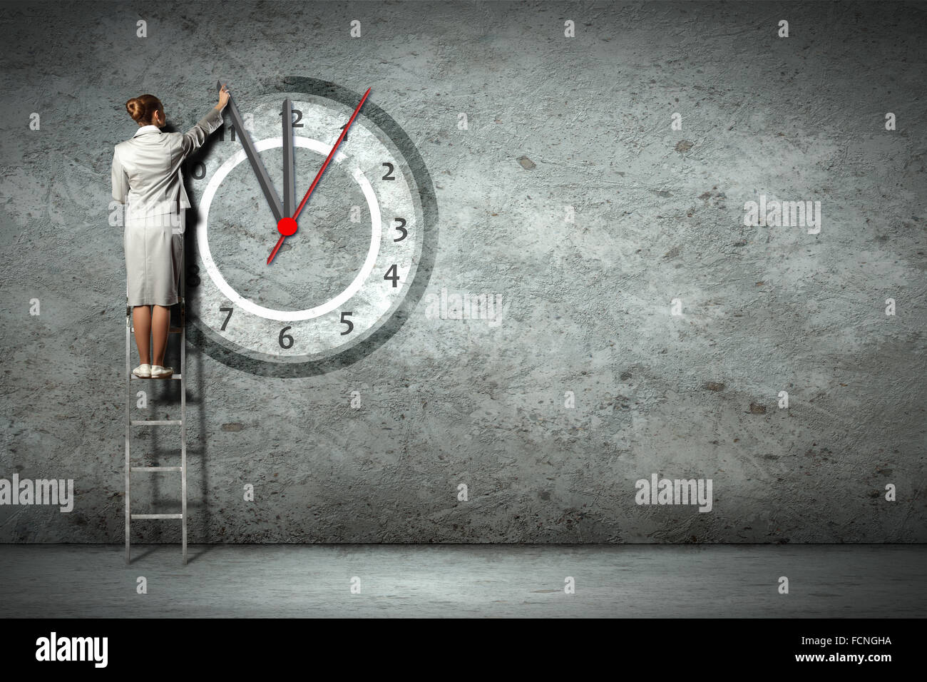 Businesswoman standing on ladder moving hands of clock Stock Photo - Alamy