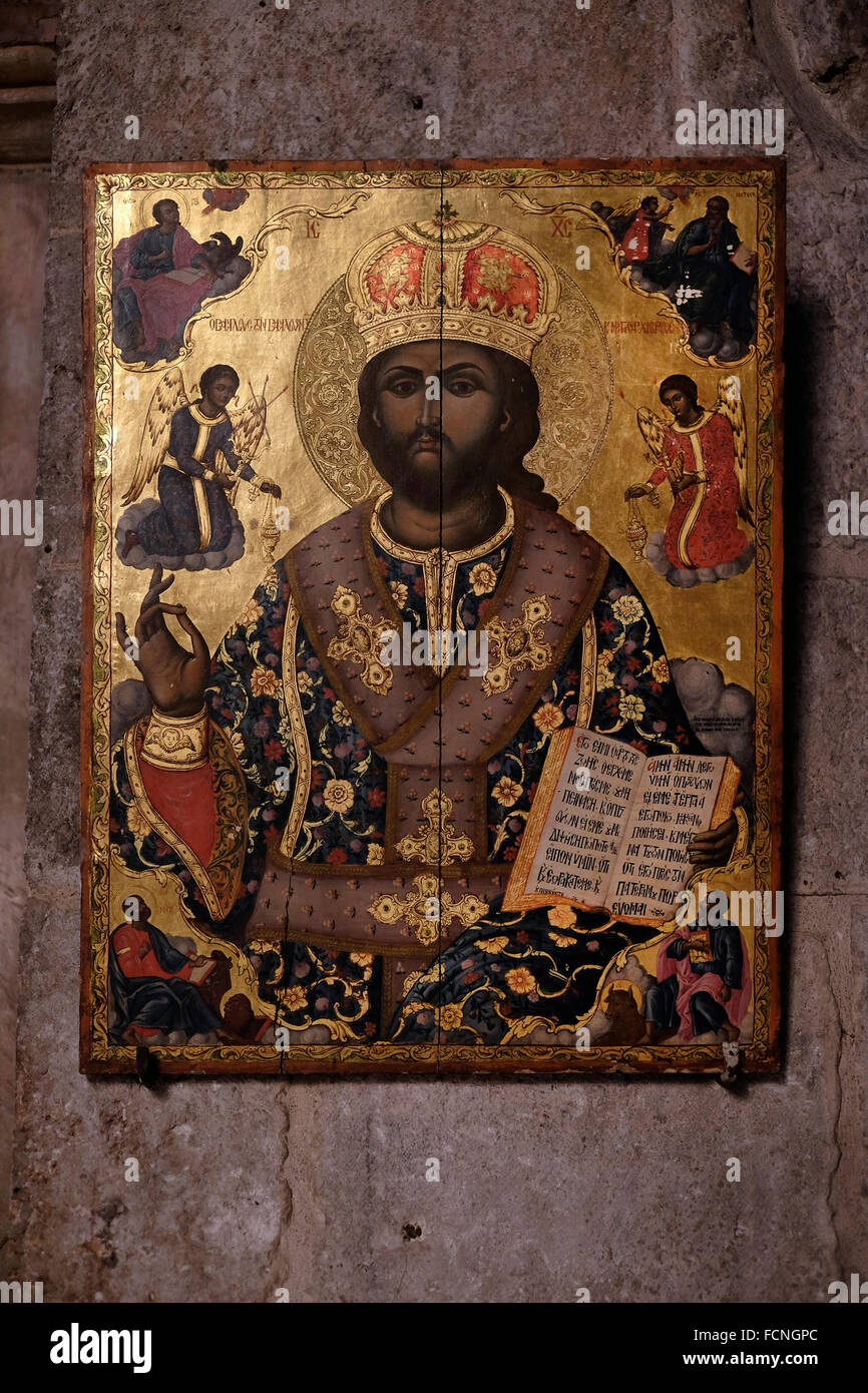 A gilded painting in Byzantine style depicting Christian icons hanged ...
