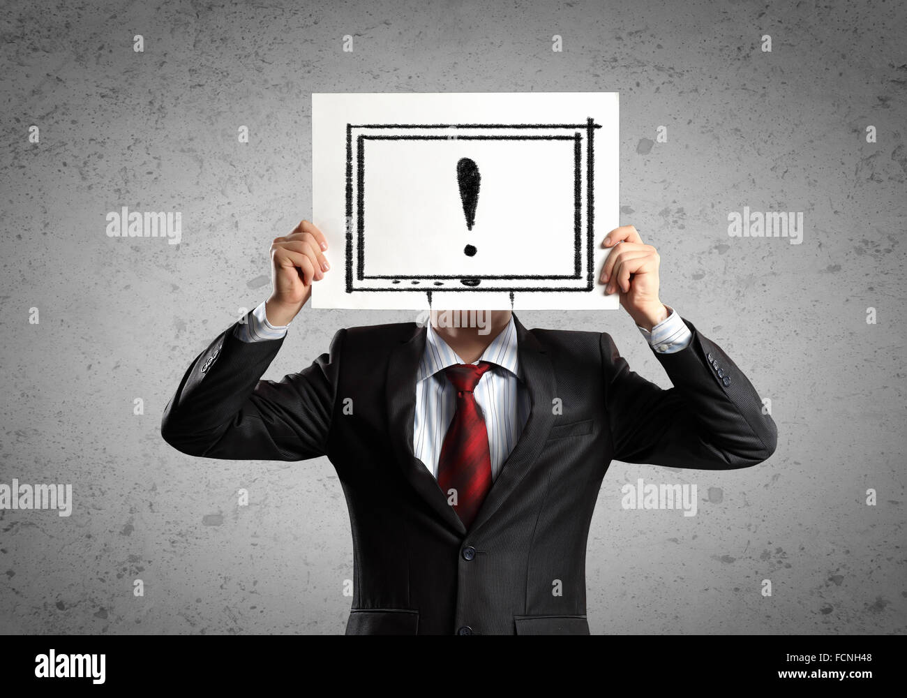 Image of businessman holding message board against face. Conceptual ...