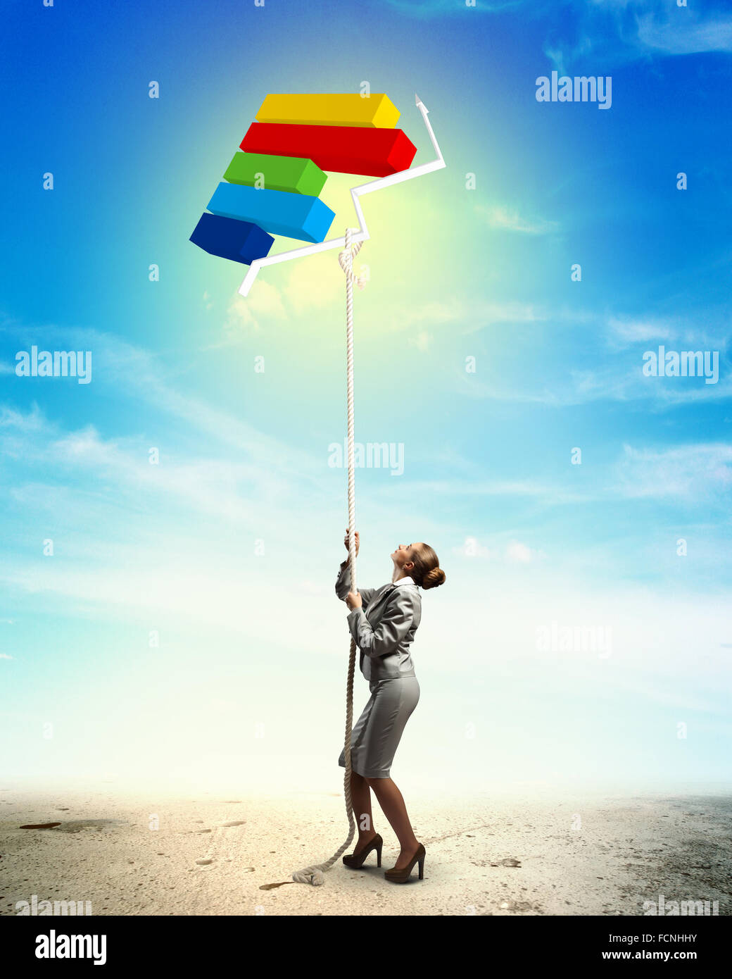 Image of businesswoman climbing the rope attached to diagram aloft ...