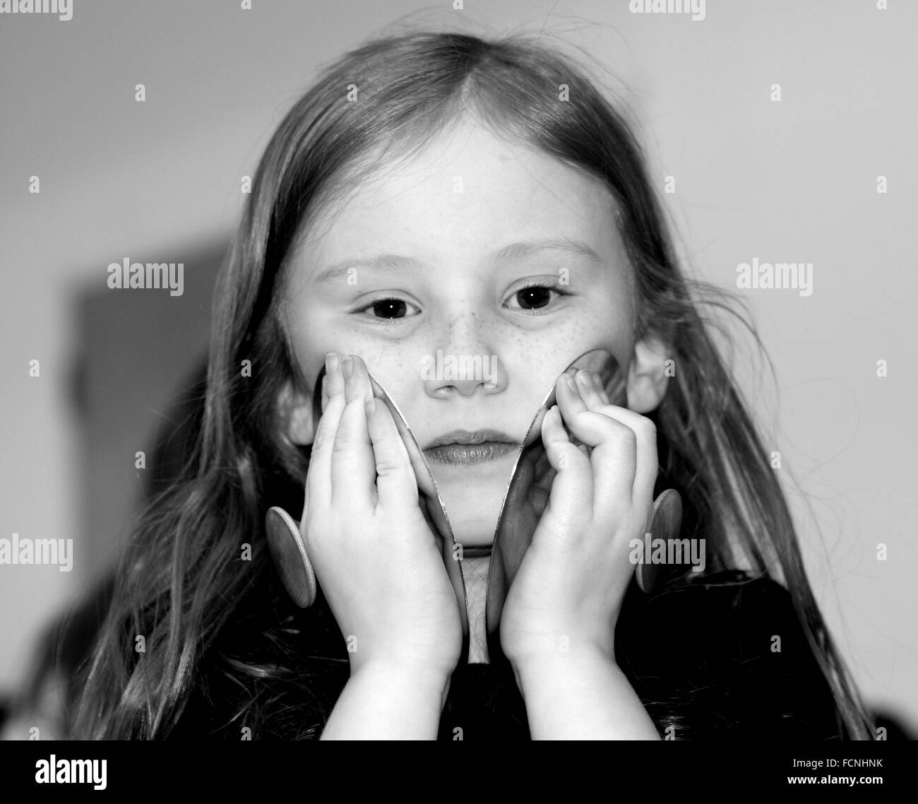 Portrait of expressionless female child Stock Photo - Alamy