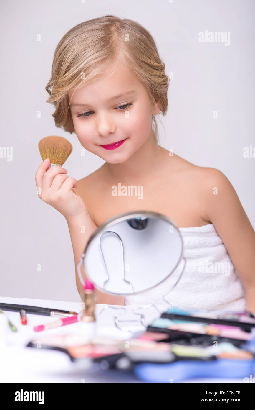 Nice little girl doing make up Stock Photo - Alamy