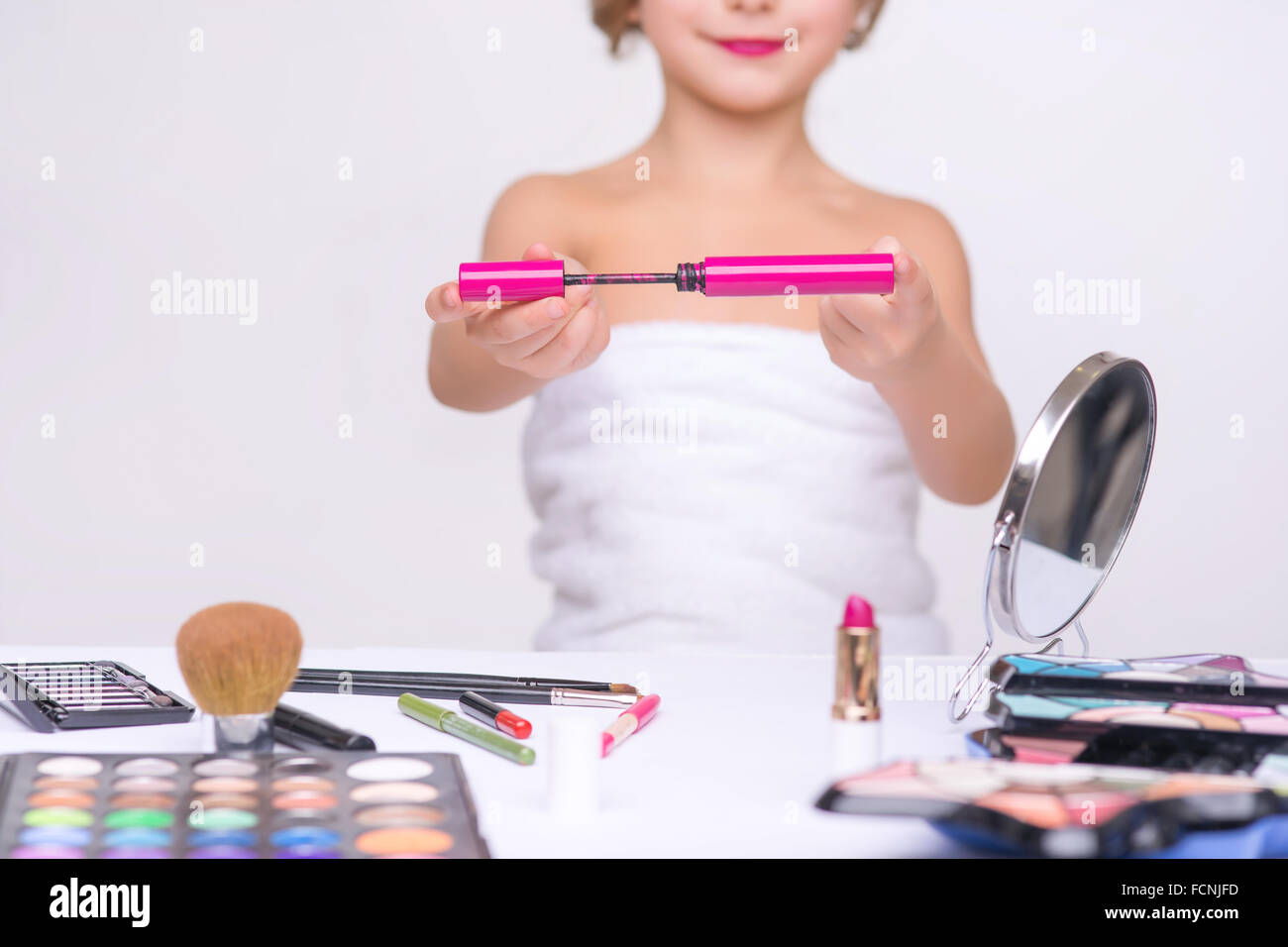 Nice little girl doing make up Stock Photo - Alamy
